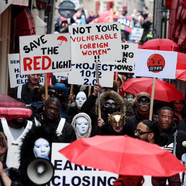 Amsterdam sex workers protest against new rules seeking to tame red ...