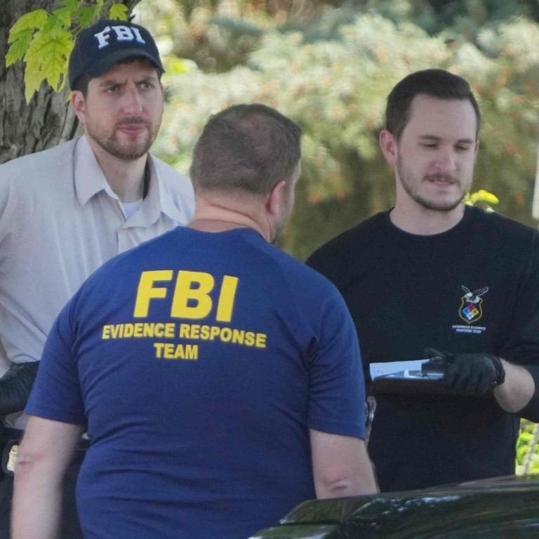 Armed US man accused of threatening Joe Biden shot dead in FBI raid ...