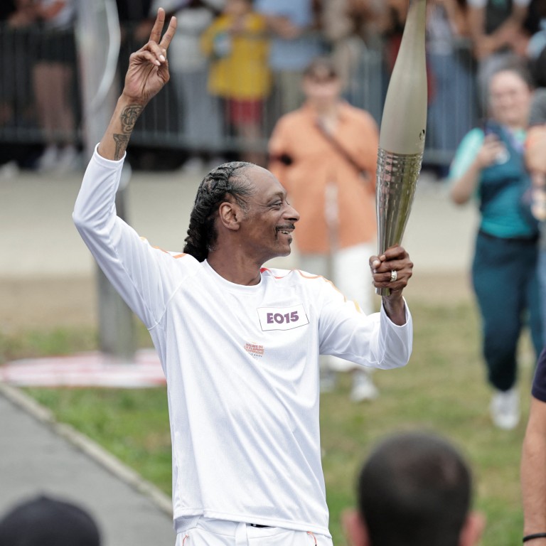 Snoop Dogg enjoying Paris Games, carries Olympic torch ahead of opening ...