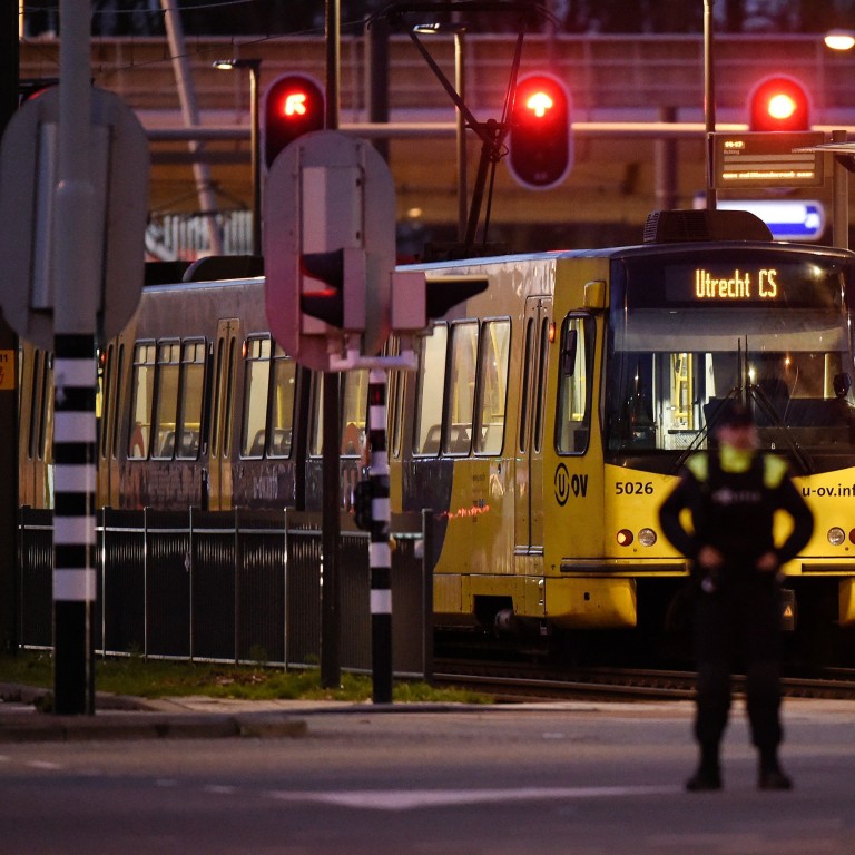 Utrecht shooting: Dutch police arrest Turkish suspect Gokmen Tanis, who ...
