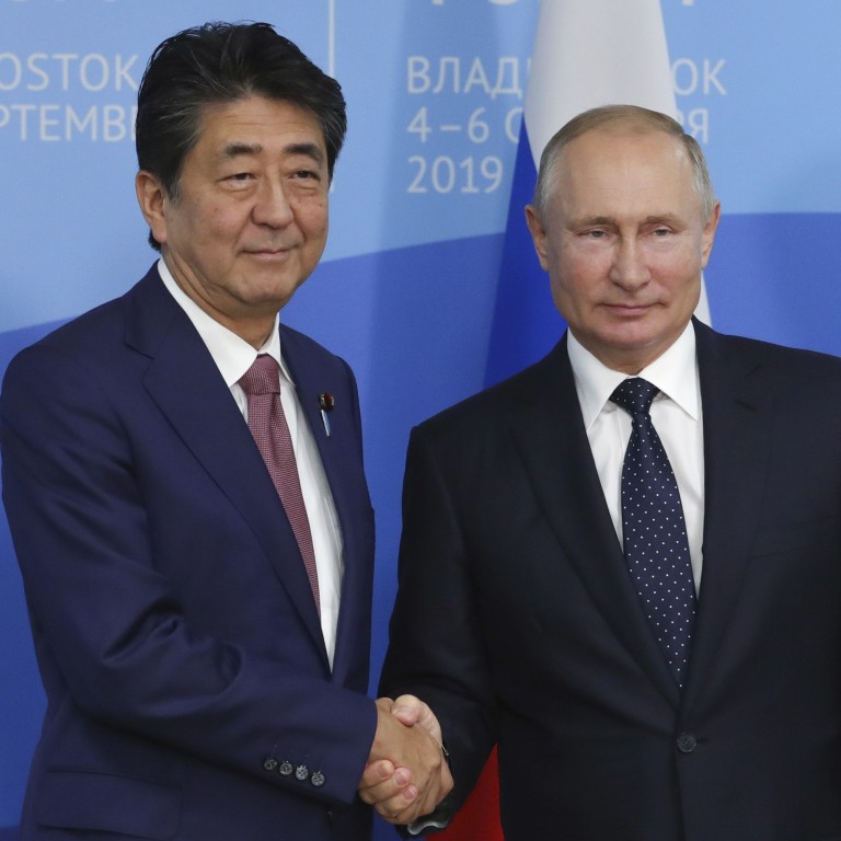 Vladimir Putin rebuffs Shinzo Abe’s call to sign peace treaty over ...