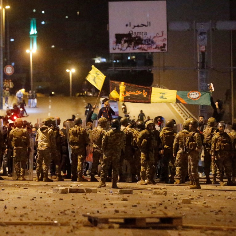 Iran-backed Hezbollah supporters clash with anti-government protesters ...