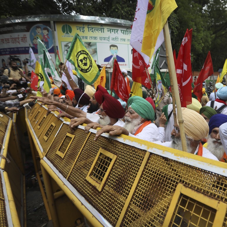 Indian farmers protest against contentious agriculture laws near ...