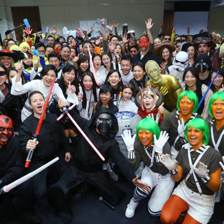 Party time: staff of UBS investment bank have fancy-dress fun to raise ...