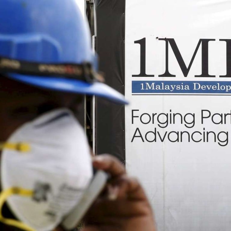 1MDB investigation: Singapore charges former banker with money ...