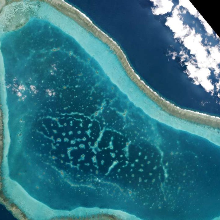 Exclusive | China to build up atoll in contested South China Sea ...