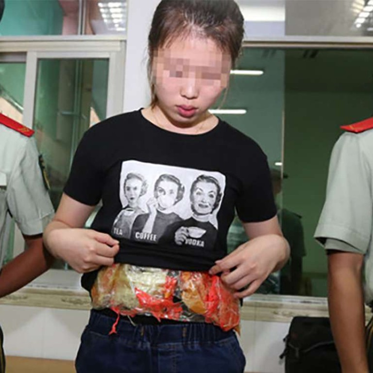 Woman caught at Shenzhen border with 15kg of hidden gold bars around ...