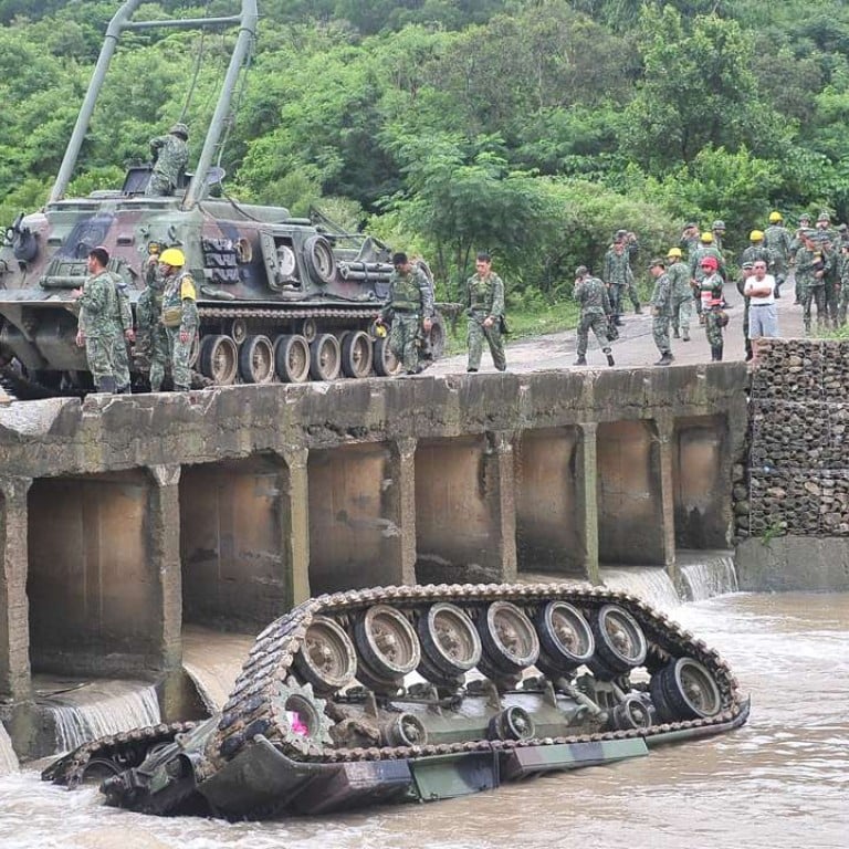 Three Taiwanese soldiers killed after tank falls off bridge in heavy ...