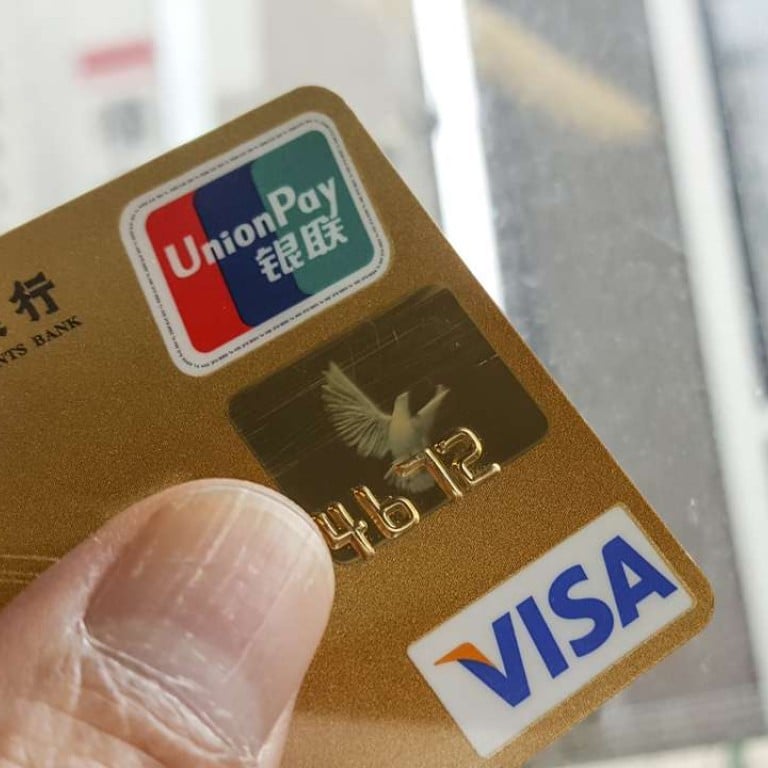 China orders banks to stop issuing dual-currency credit cards to stem ...