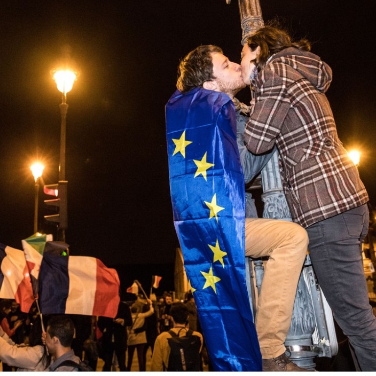 Celebration and relief outside the Louvre, as Macron’s supporters sing ...