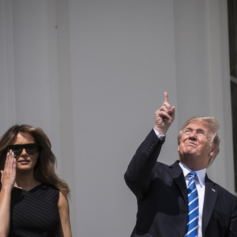 Donald Trump stares at eclipse without glasses. Don’t look, shouts a ...