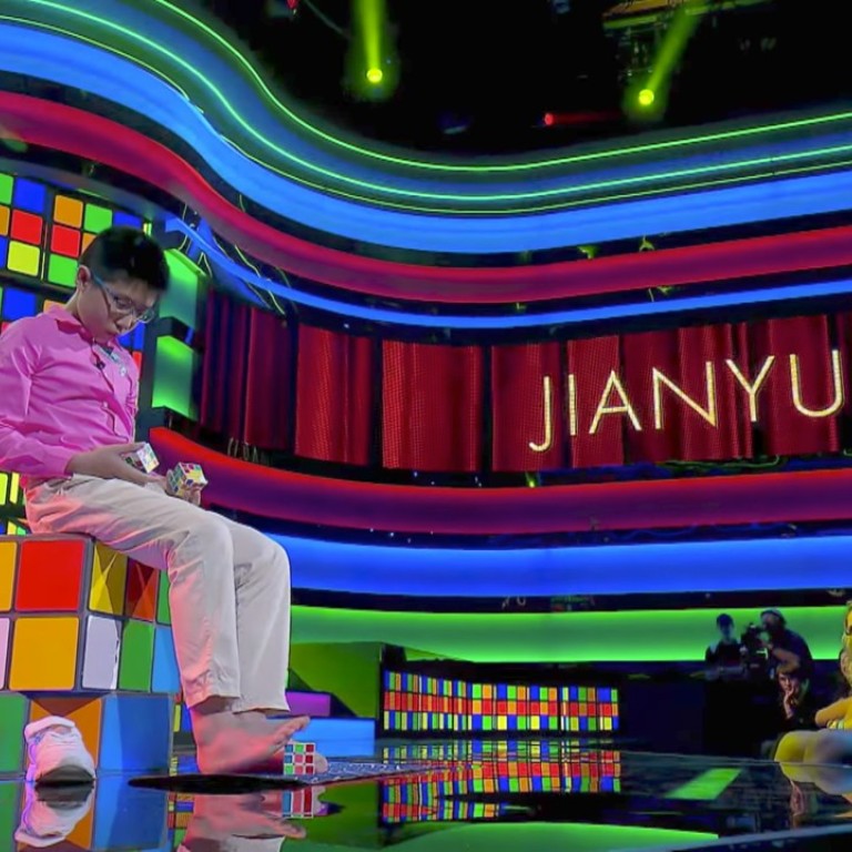 Chinese boy solves 3 Rubik’s cubes at once with both hands – and feet ...