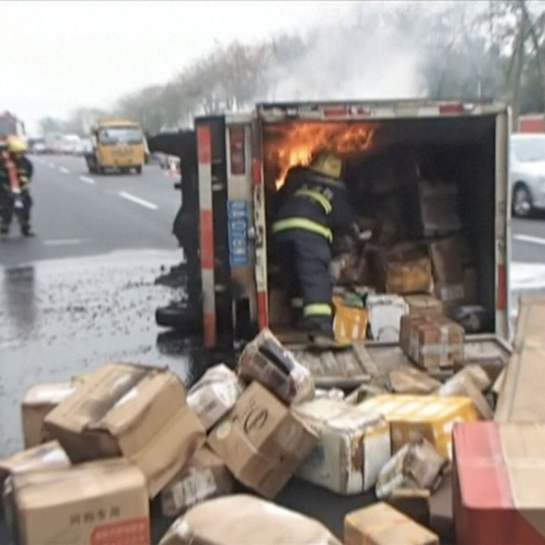 Delivery truck carrying 500 parcels bursts into flames on motorway in ...