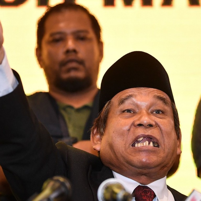 Malaysian shaman who tried to find missing plane MH370 with coconuts ...