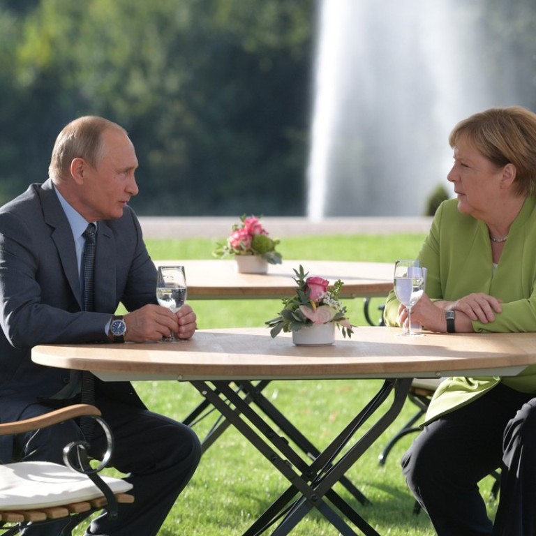 Merkel and Putin tackle tough topics in meeting outside Berlin | South ...