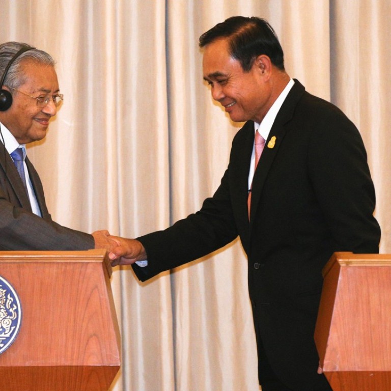 Malaysian PM Mahathir Mohamad and Thai PM Prayuth Chan-ocha discuss ...