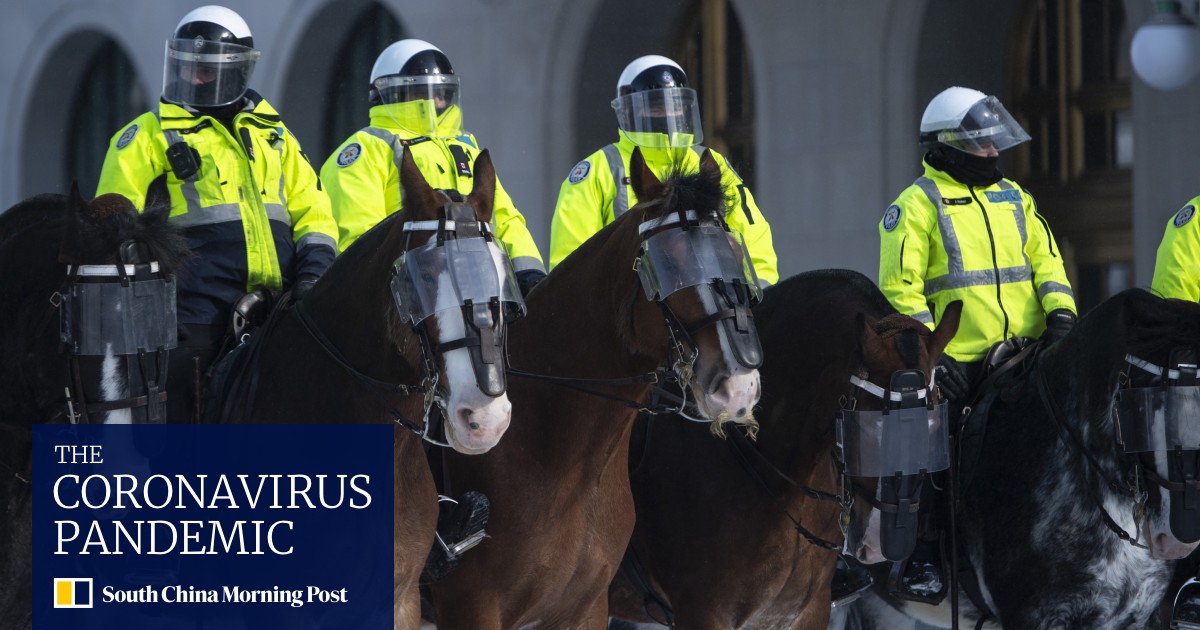Canadian police in riot gear clear main protest hub in Ottawa as ...