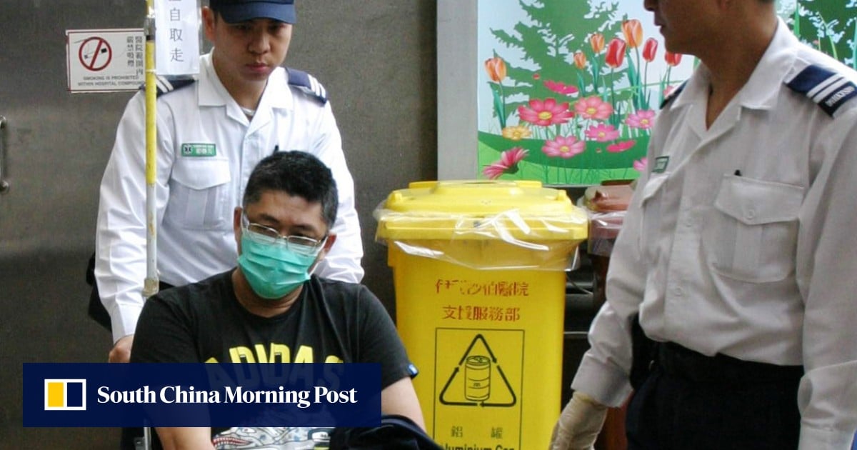 Two suspected triad members arrested after attack on newspaper ...