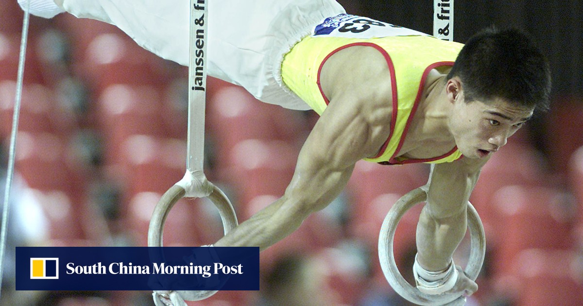 Former champion Chinese gymnast back on the streets doing handstands ...