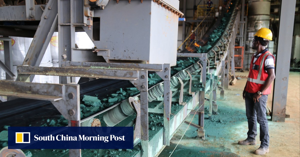 Chinese using a mobile phone in Beijing effectively manage cobalt mines ...