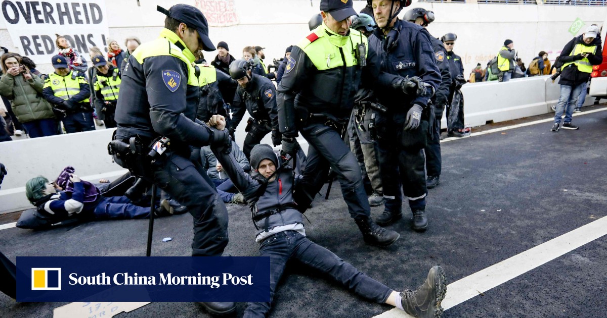 Dutch police arrest dozens of climate activists protesting in The Hague ...