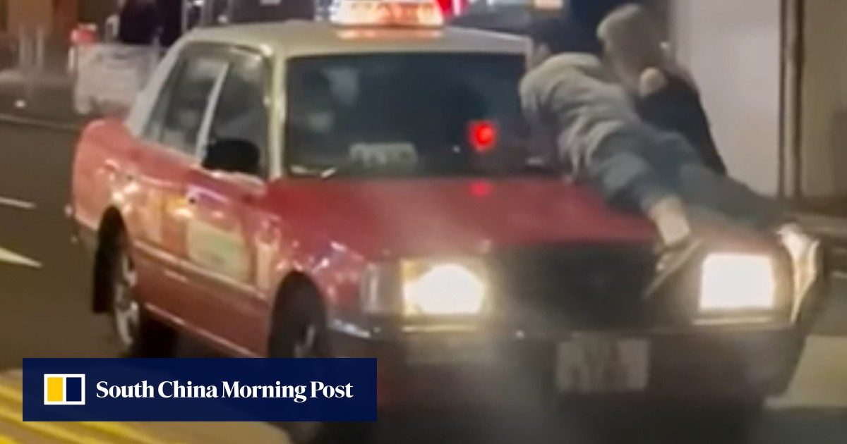 Hong Kong road rage video showing man clinging to reversing taxi goes ...