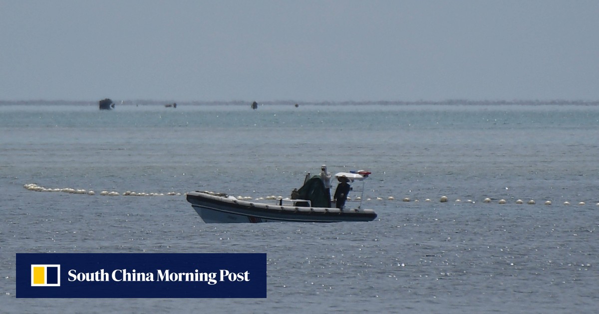South China Sea: Philippines slams Beijing’s fishermen-blocking ‘floating barrier’ in ...
