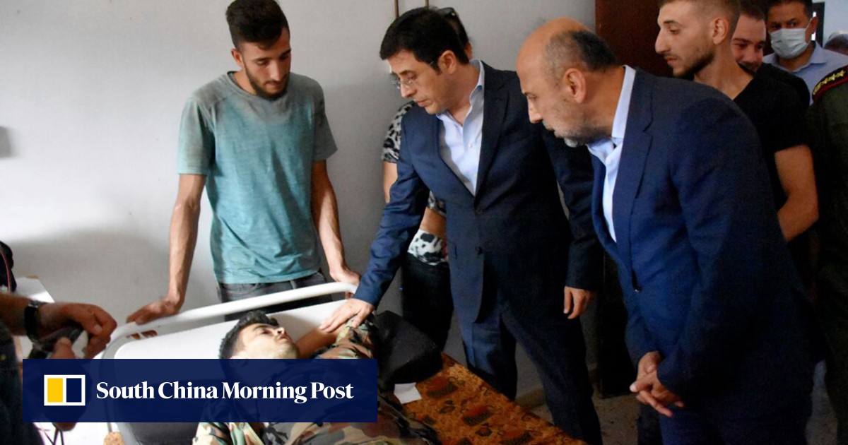 Drone attack kills at least 80 at a packed Syria military graduation ...