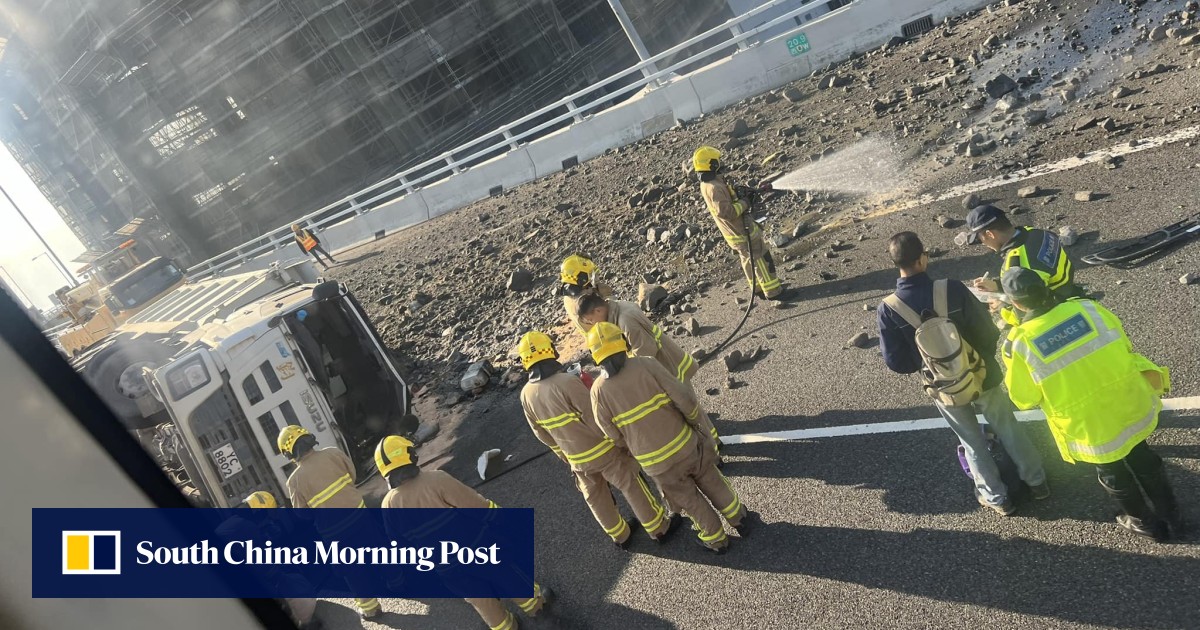 Hong Kong driver escapes injury after dump truck topples over and ...