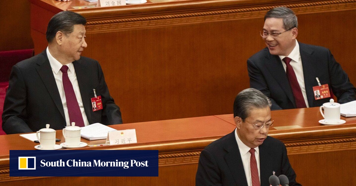 Smiles, a few words … China’s new premier makes his debut next to Xi ...