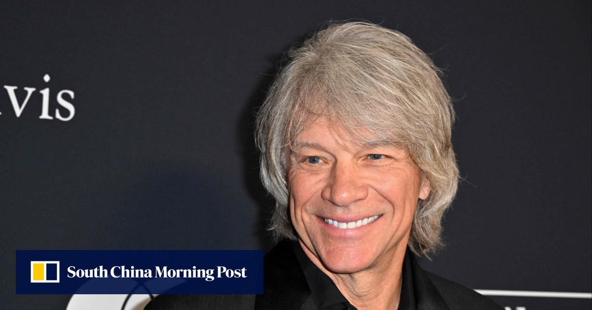Keep the faith: Grammy-winning star Jon Bon Jovi helps woman standing ...