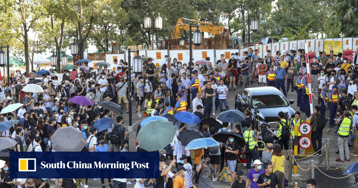 Riot police rescue Chinese affairs minister trapped in his car by Hong ...