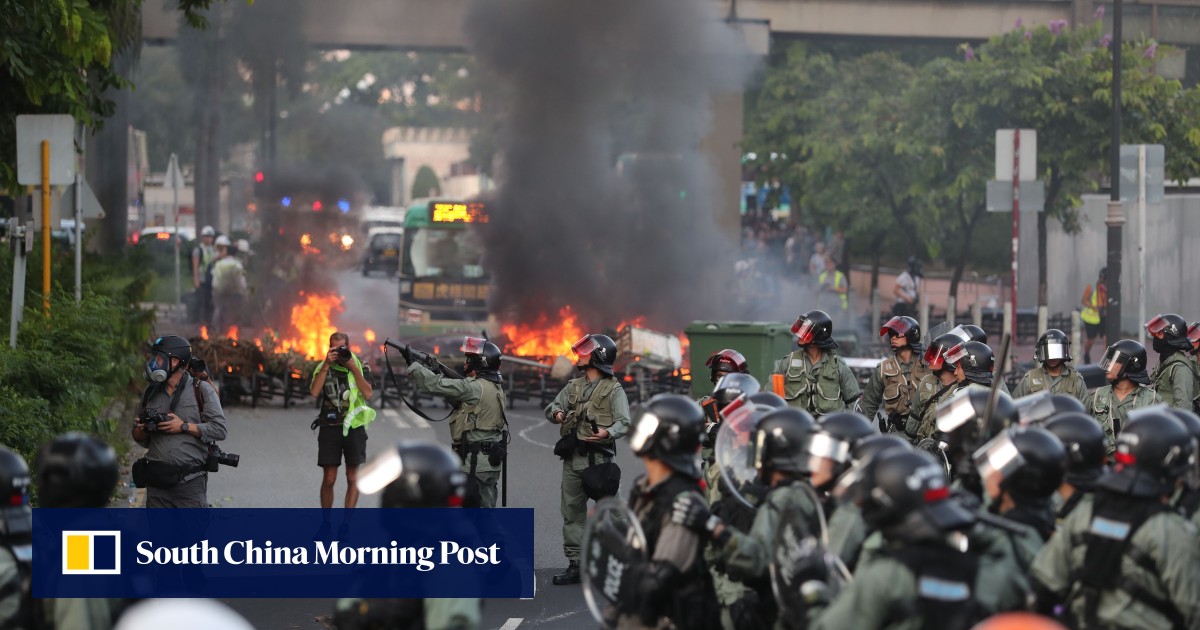 Hong Kong government officer arrested on bus at police roadblock during ...