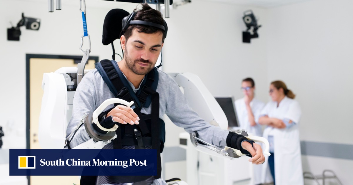 Paralysed man in France walks again with brain-controlled exoskeleton ...