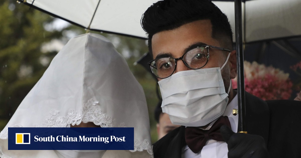 A coronavirus wedding: masks in matching white, no guests beyond family ...