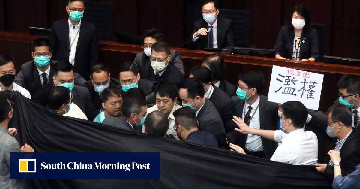 Chaos at Hong Kong’s Legislative Council as opposition lawmakers thrown ...