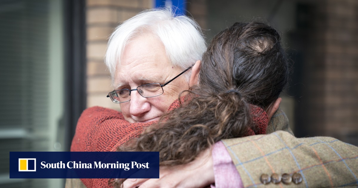 Former UK ambassador Craig Murray hands himself in to police to begin ...