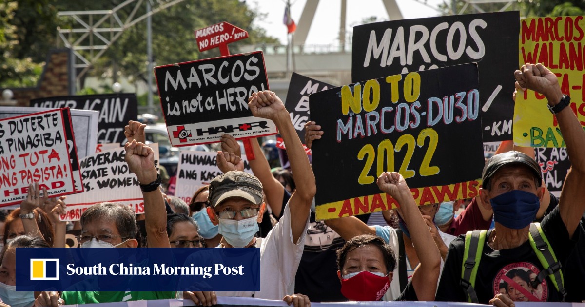 Filipino protesters carry ‘Marcos is no hero’ and ‘never again’ banners ...