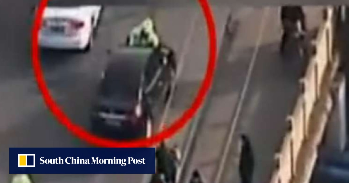 Chinese man arrested after driving off with policeman hanging on to car ...