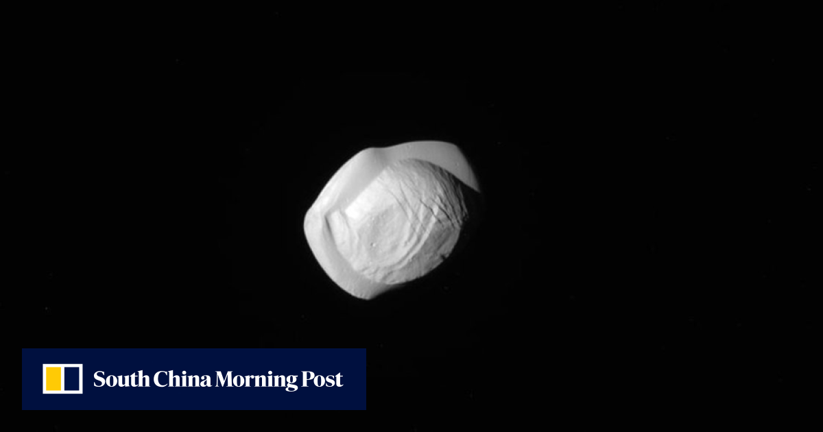 New closest-ever photos of Saturn’s moon show it looks like a frozen ...