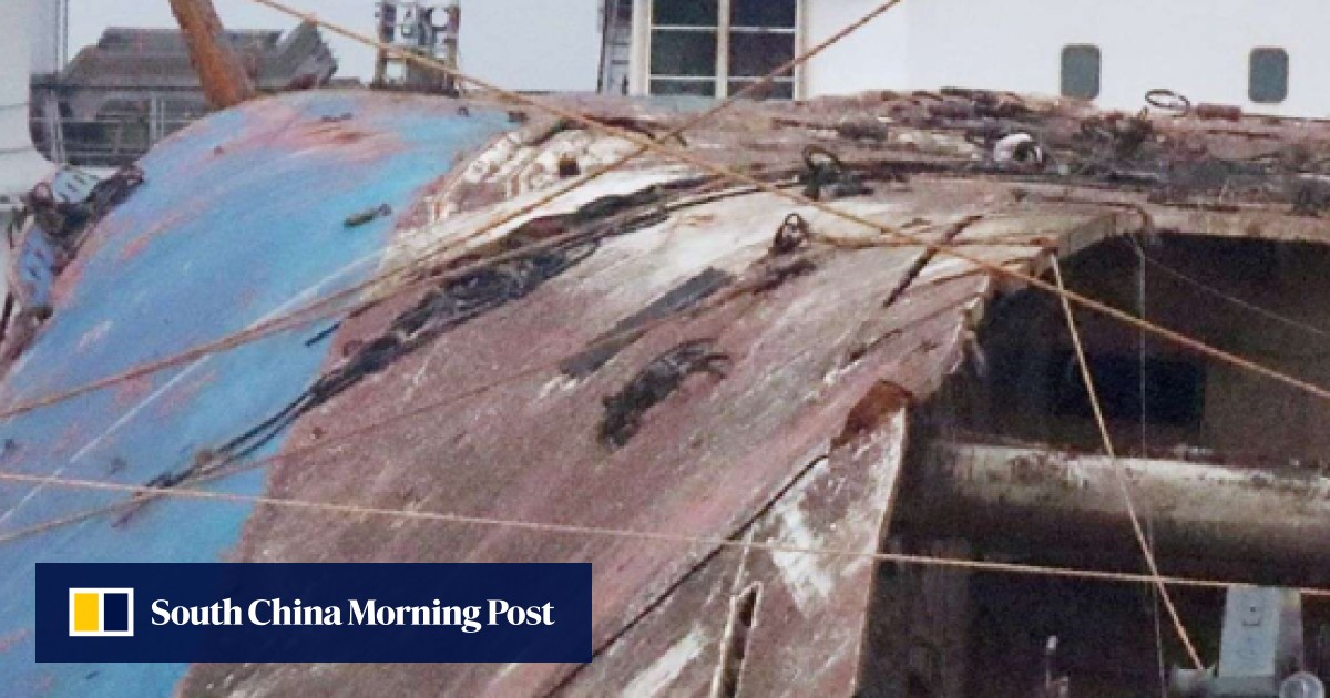 Raised Sewol ferry loaded onto transport vessel, completing most ...