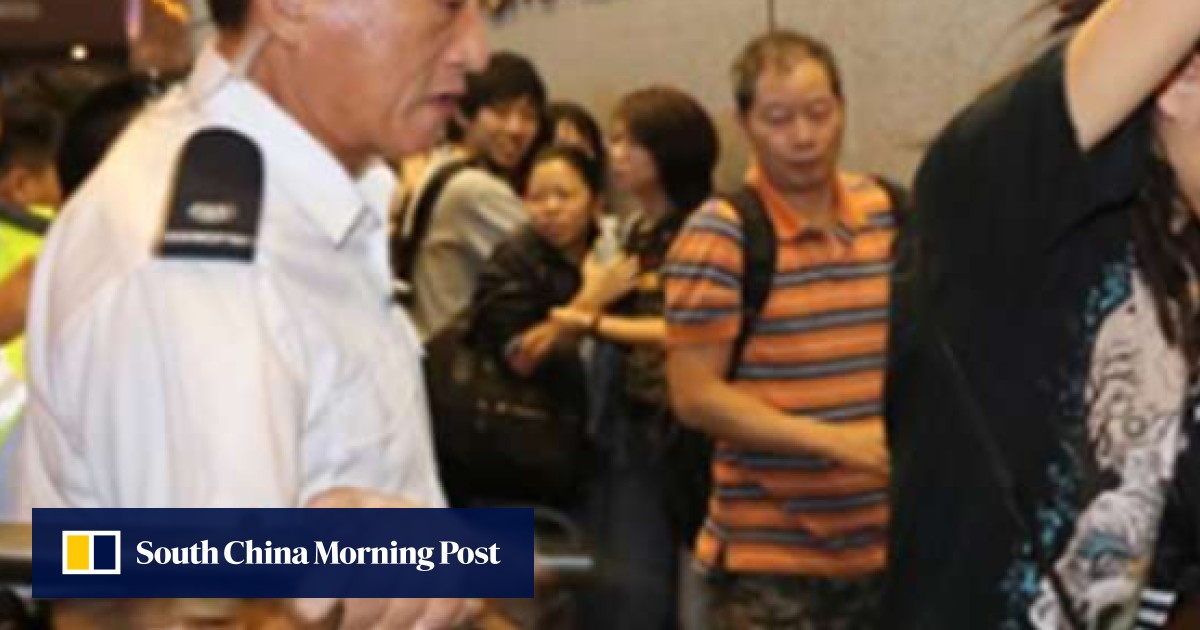 Retired Hong Kong policeman charged with assault for striking bystander ...