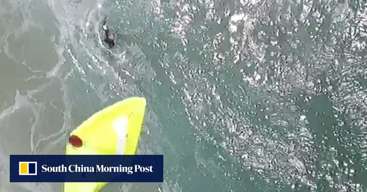 Watch as drone races to the rescue of swimmers caught in Australian ...
