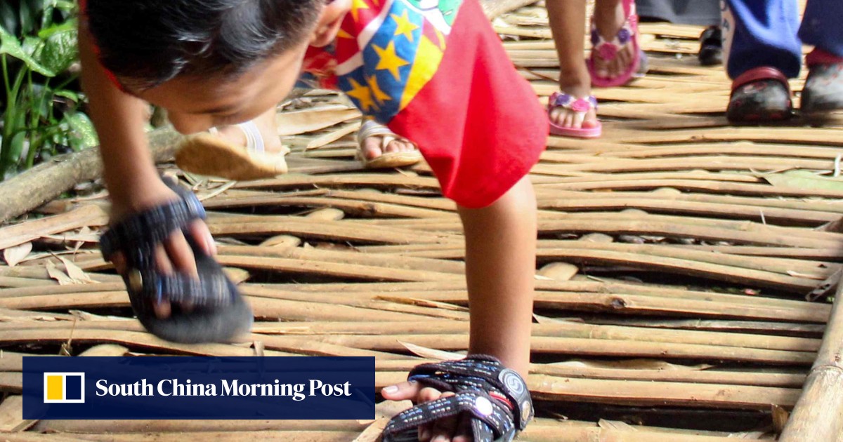 On hand and foot: Disabled Indonesian child’s ‘school crawl’ becomes a ...
