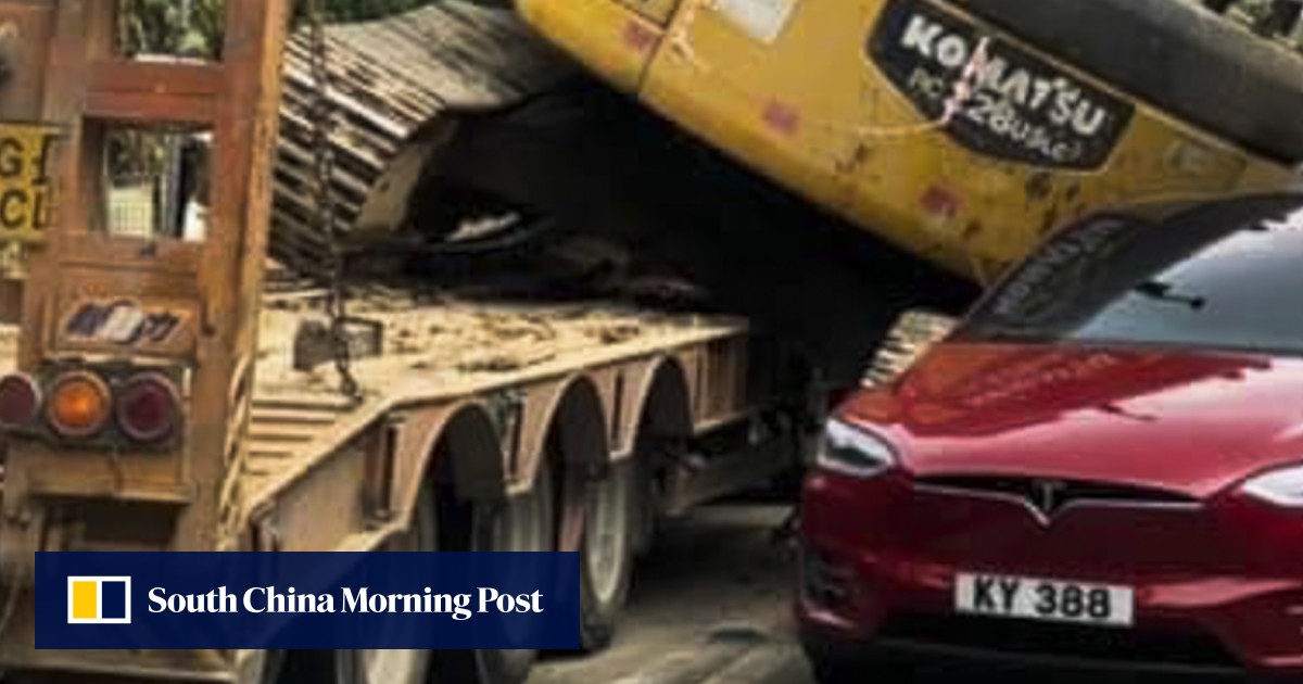 Bulldozer falls from truck onto passing Tesla on Hong Kong road | South ...