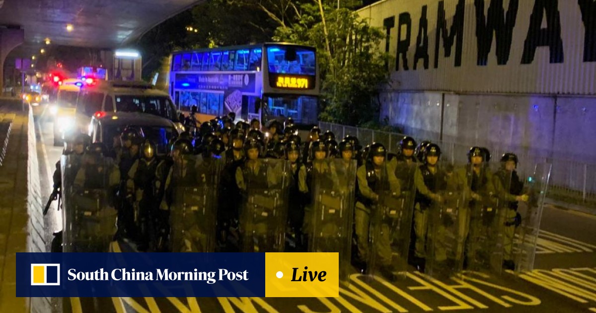 Riot police advance on extradition bill protesters and warn they will ...