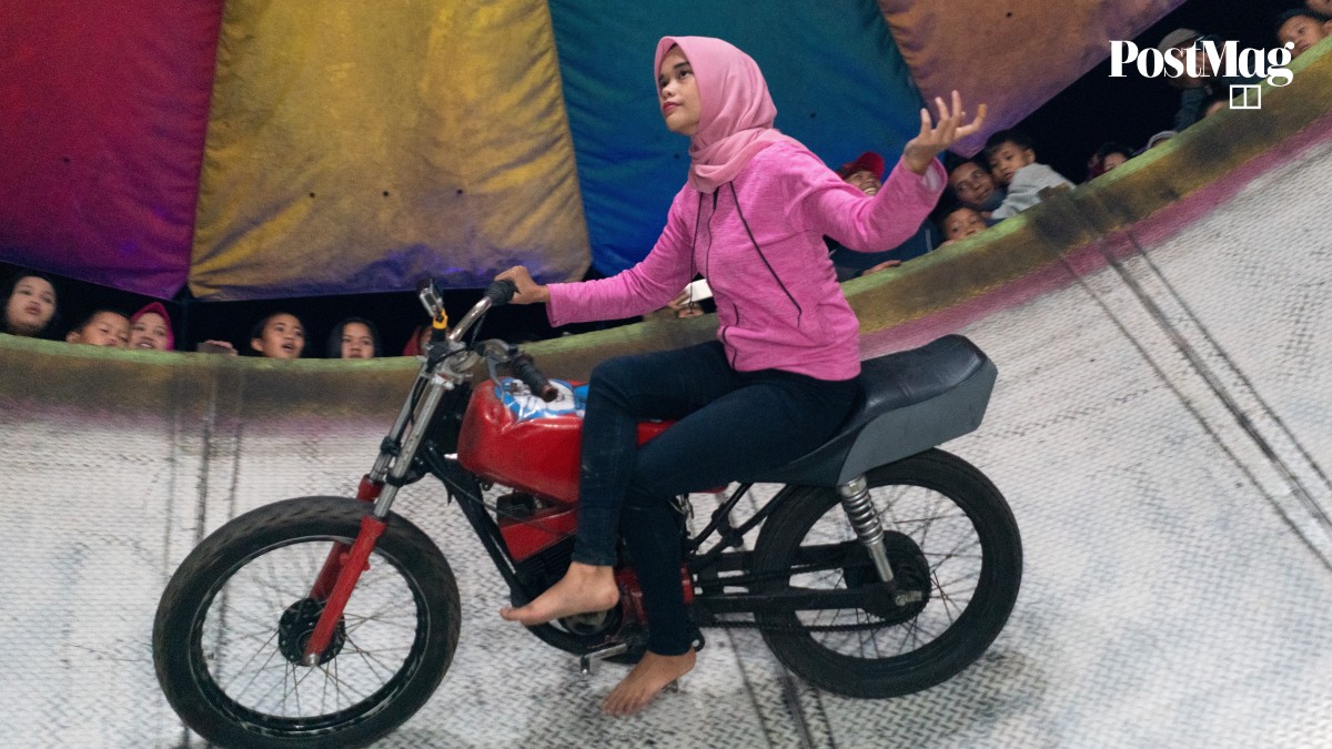 How Indonesia’s hijab-wearing female stunt bike rider is giving the men ...