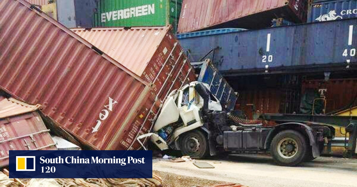 Unconscious driver pulled from truck crushed by tumbling shipping ...