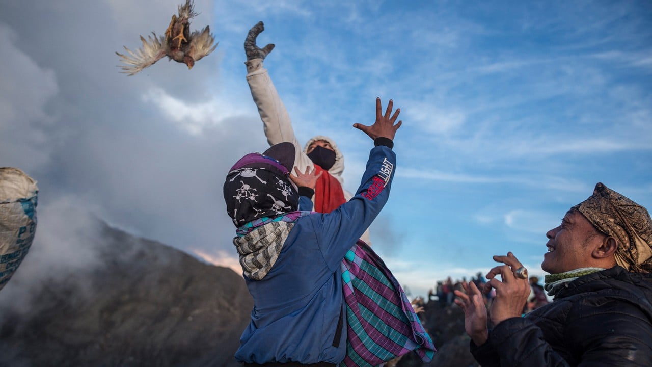 Thrown in a volcano: Indonesian devotees gather in thousands to ...